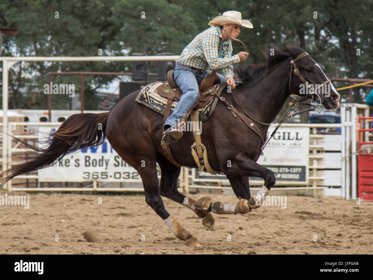Barrel racing action at the rodeo in Cottonwood, California Stock Photo ...