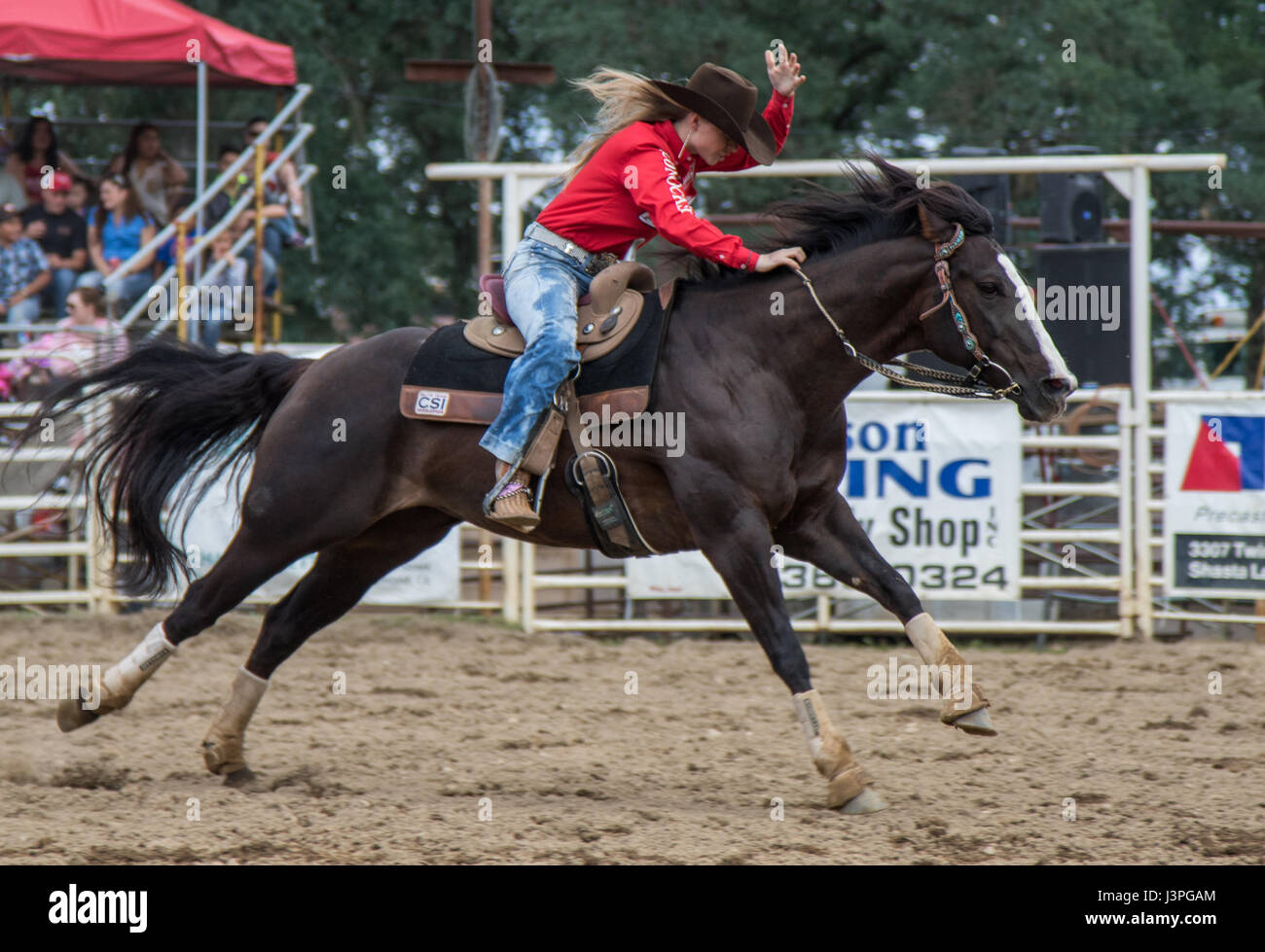 Barrel racing action at the rodeo in Cottonwood, California Stock Photo ...