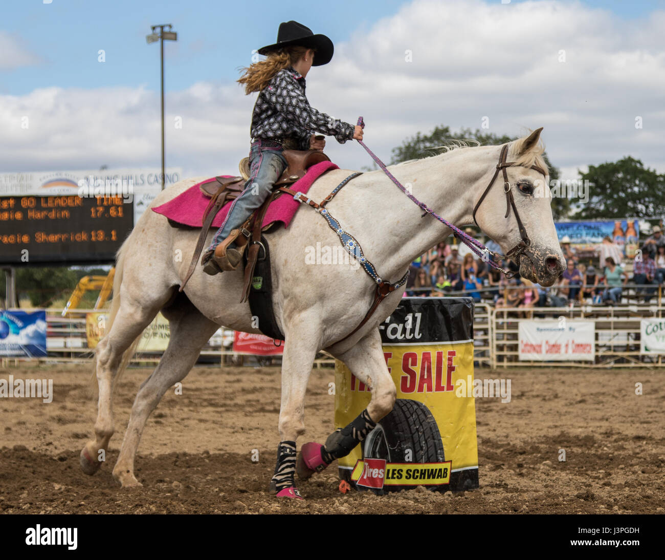 Barrel racing cowgirls in action at the rodeo in Cottonwood, California ...