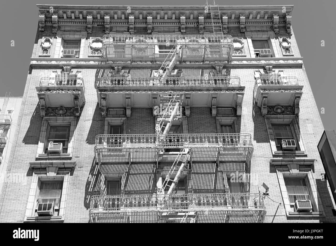 Fire escape and stairs on exterior of walk up apartment building Stock ...
