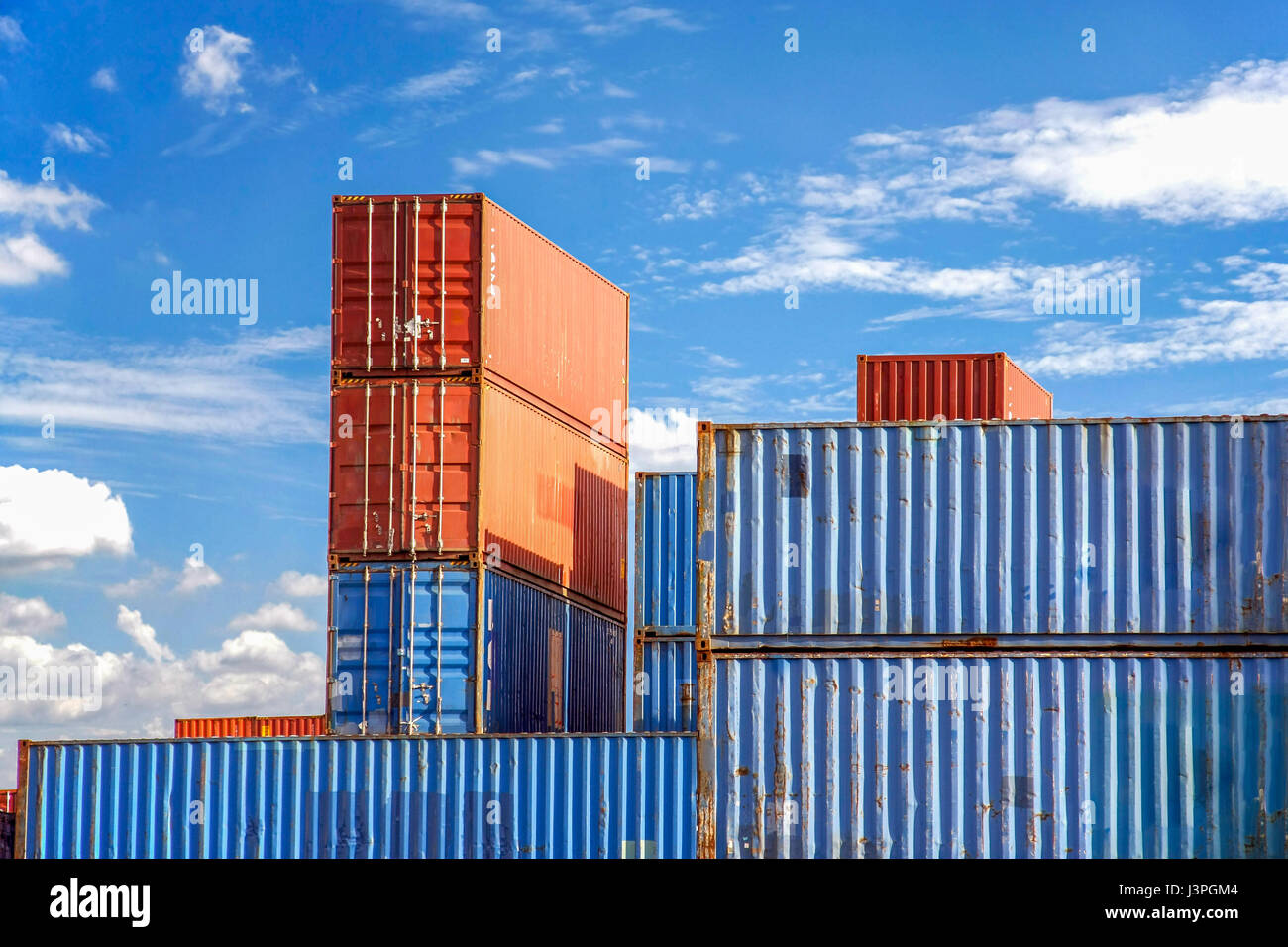 Stack of Cargo Containers in an intermodal yard with blue sky Stock ...