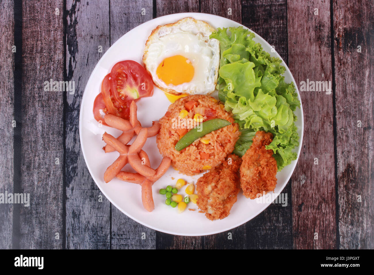 American style breakfast set, American fried rice topped sunny up egg ...