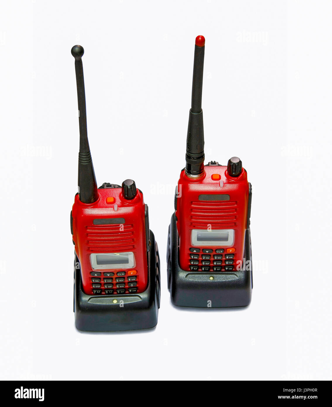 two red radio communication in chargers on white background Stock Photo ...