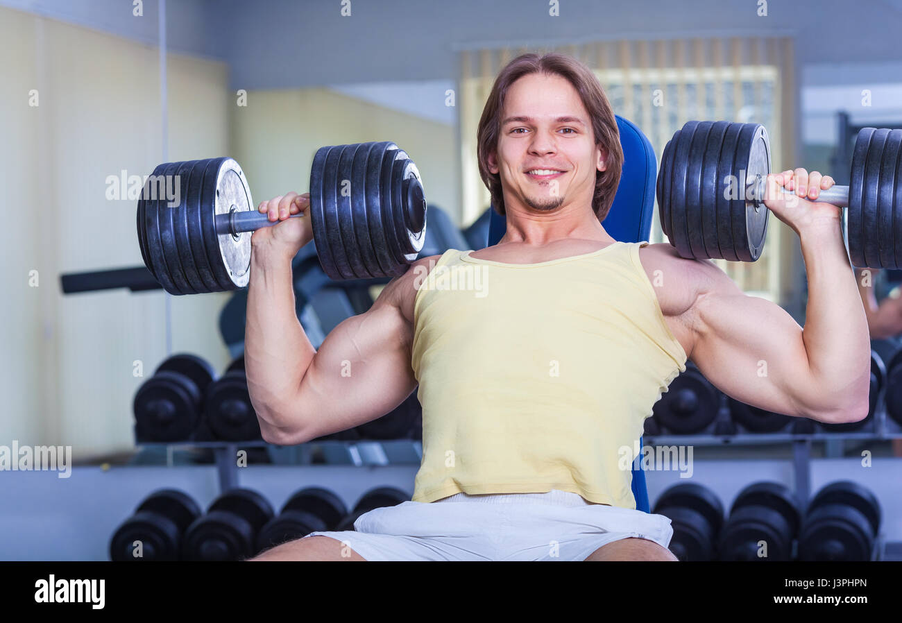 Man lifting gym smiling hi-res stock photography and images - Alamy