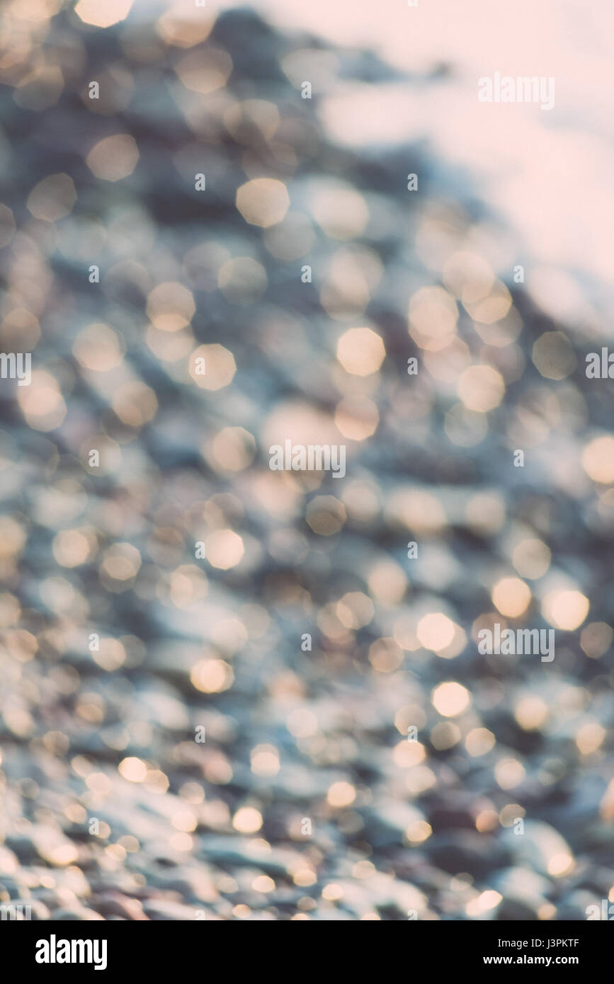 out of focus blur background with sea water in sunset light - retro ...