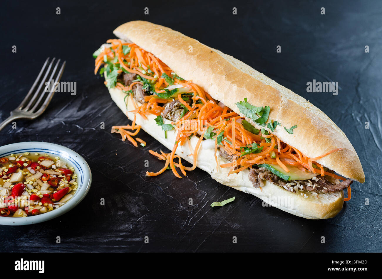 Vietnamese Pork Banh Mi Sandwich with Cilantro and carrot close-up ...