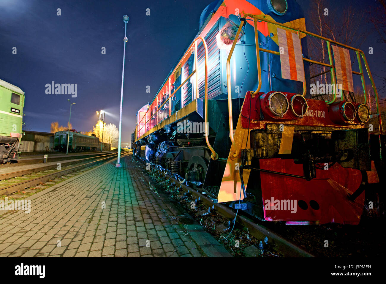Soviet locomotive train colored at night Stock Photo - Alamy