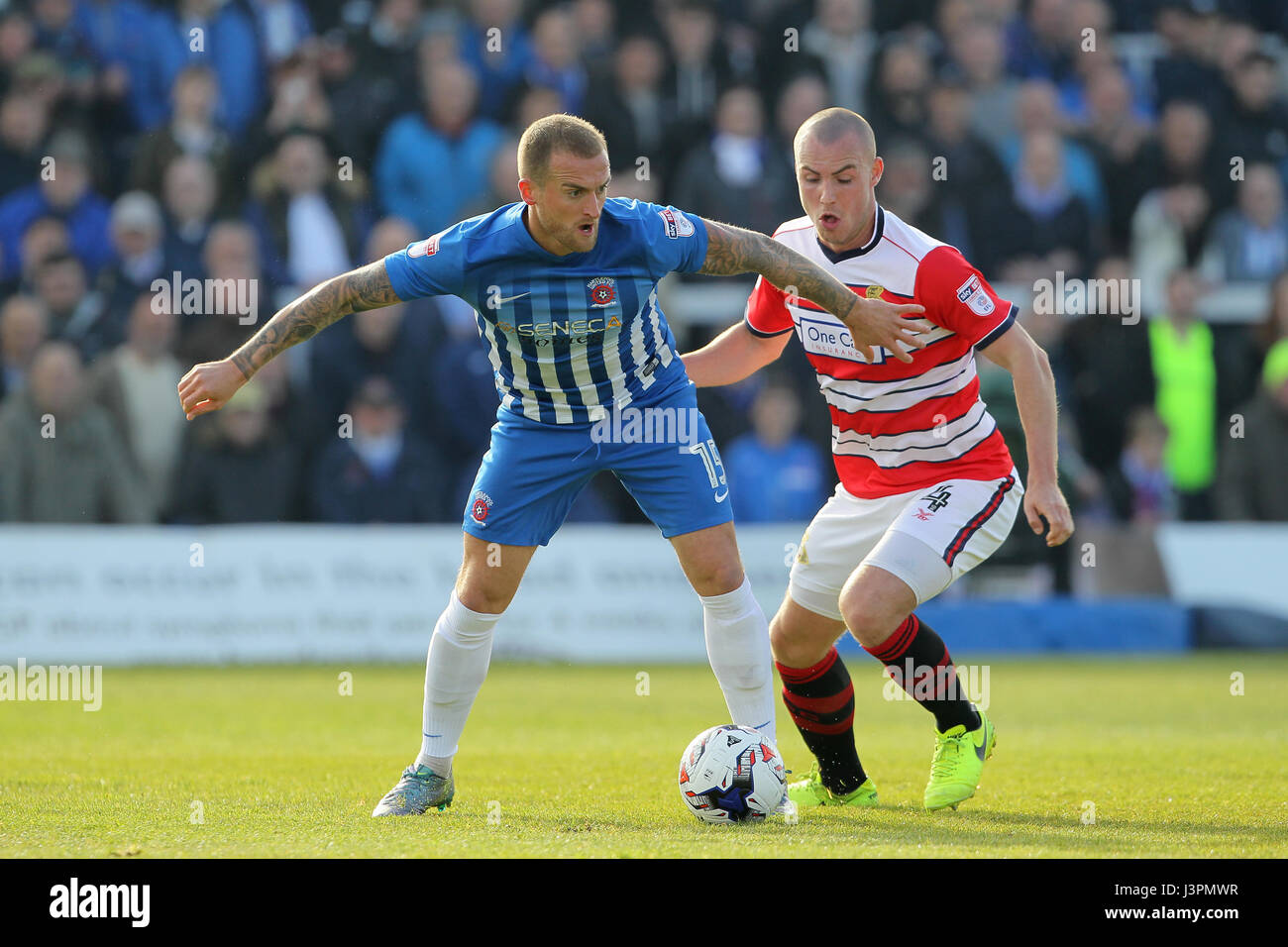 Hartlepool's Lewis Alessandra and Doncaster's Luke McCullough battle ...