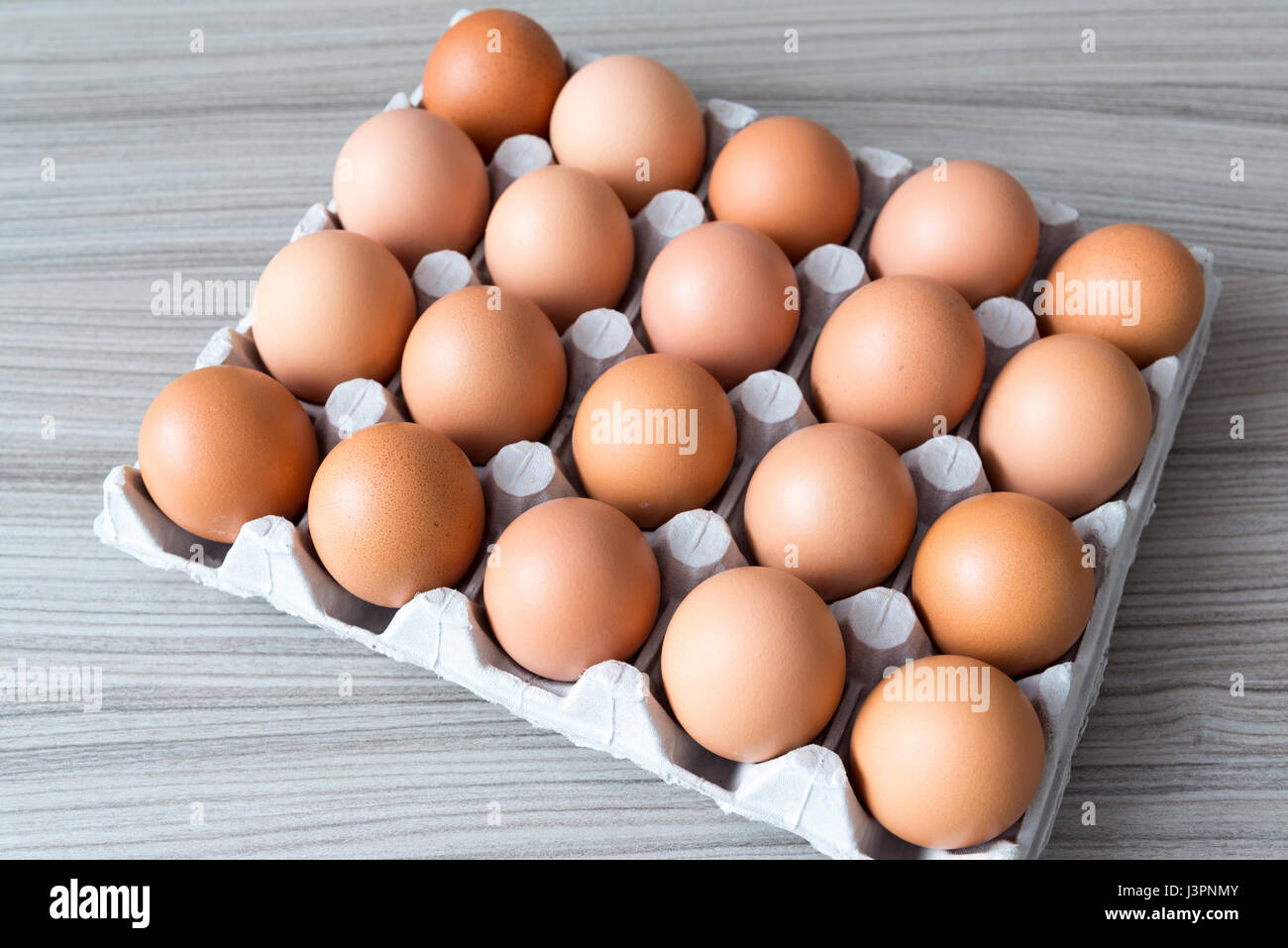 Brown chicken eggs in a cardboard box Stock Photo - Alamy