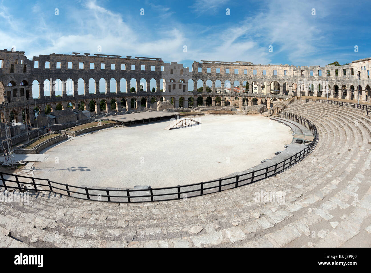 The Roman Amphitheater of Pula, Croatia shot at dusk. It was ...
