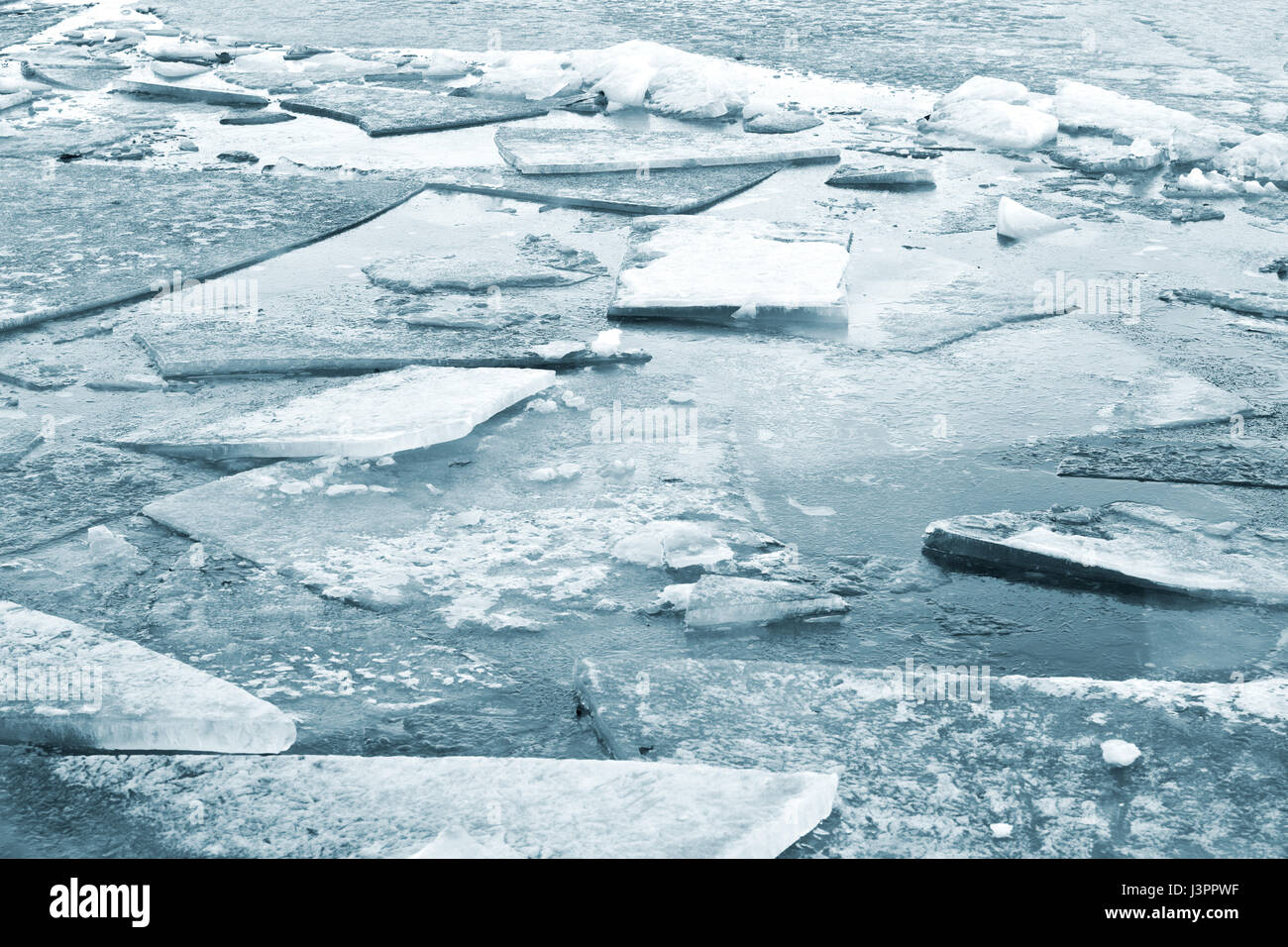 Fragments of ice on the surface of the frozen river Stock Photo - Alamy