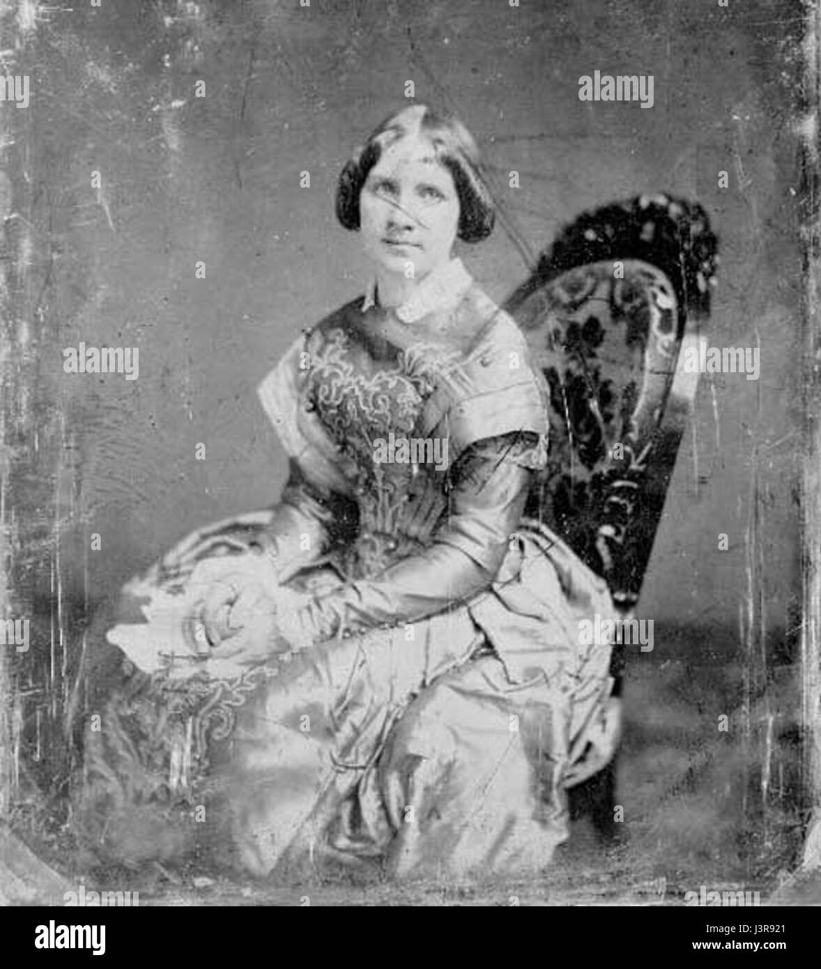 Jenny Lind, the Swedish opera singer, is captured sitting in a pose ...