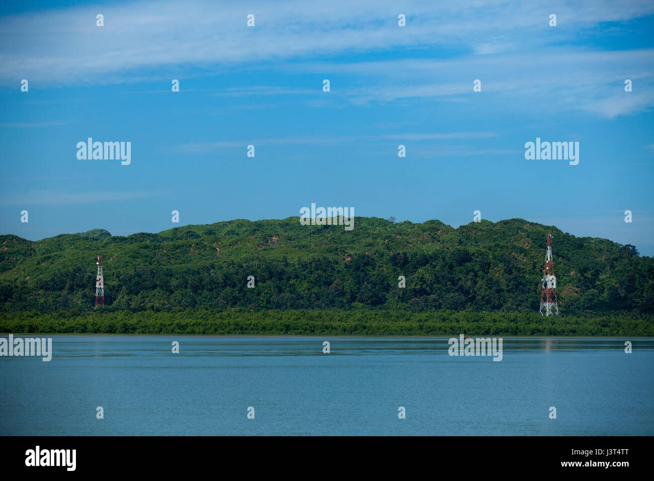 Mobile phone network tower on the bank of Naf River and beside the Ne ...