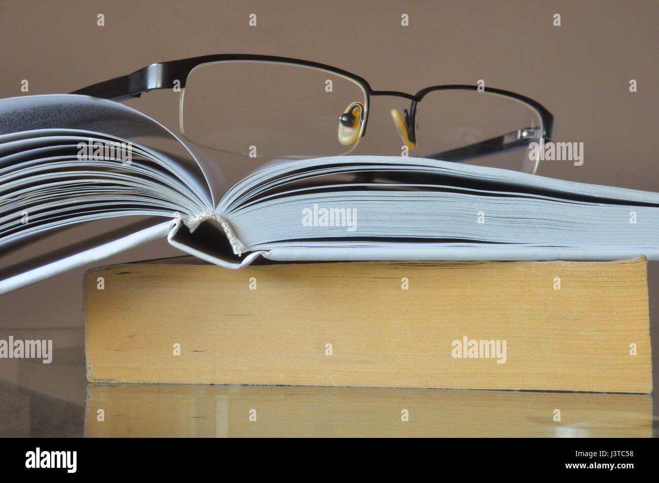 Books waiting to be read Stock Photo - Alamy