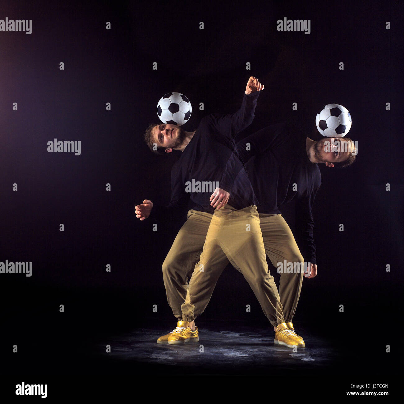 A portrait of a fan with ball on gray studio background. Freestile ...