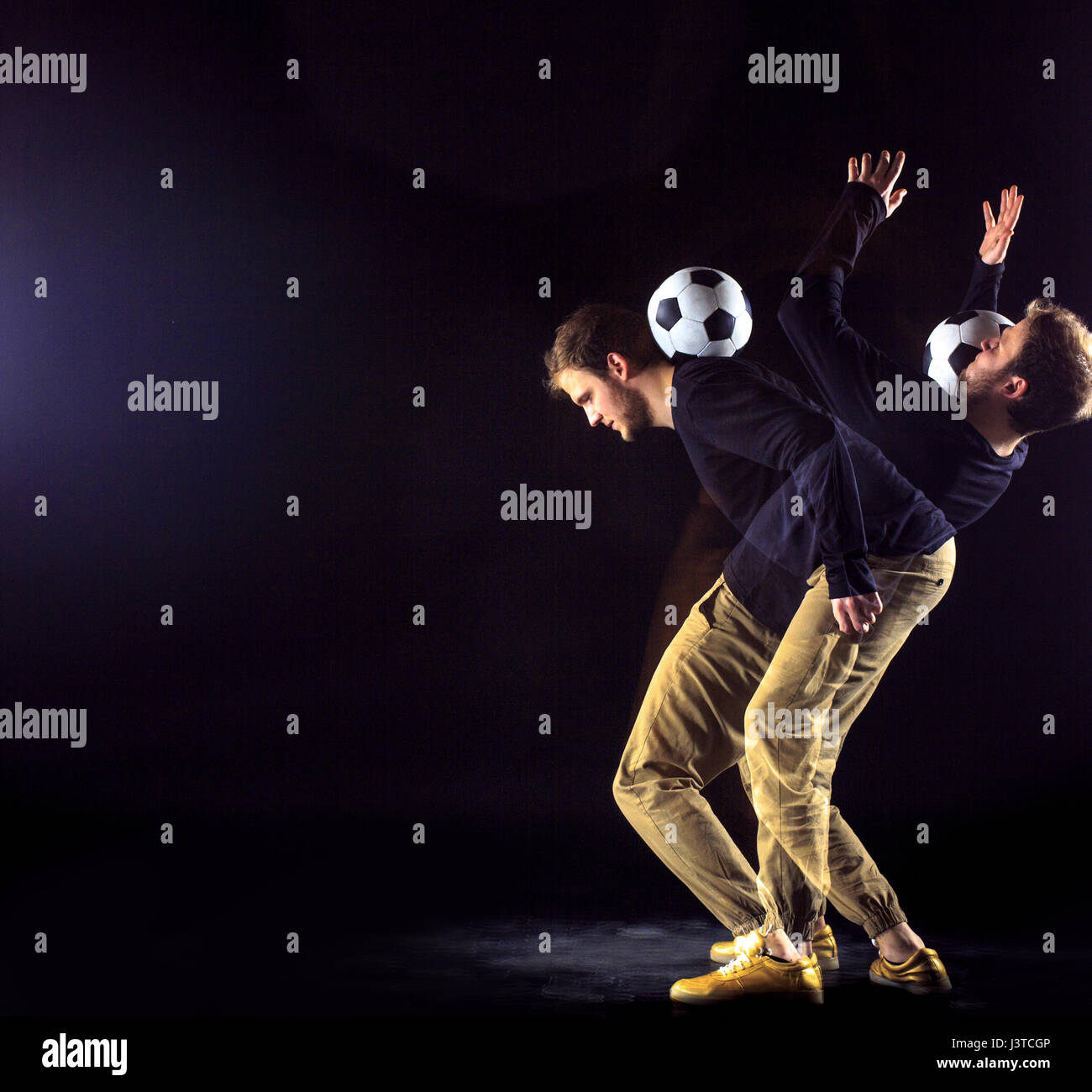 A portrait of a fan with ball on gray studio background. Freestile ...