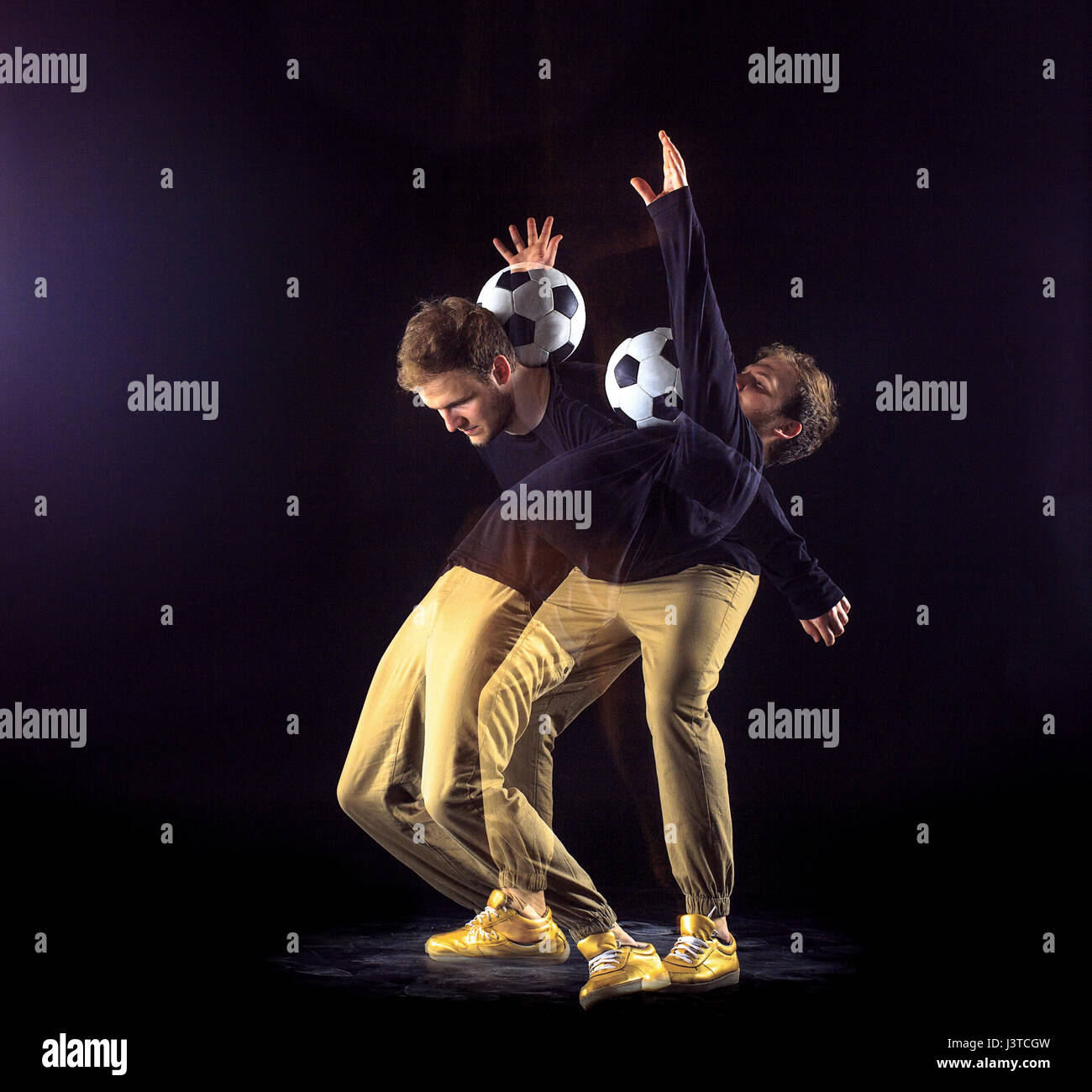 A portrait of a fan with ball on gray studio background. Freestile ...