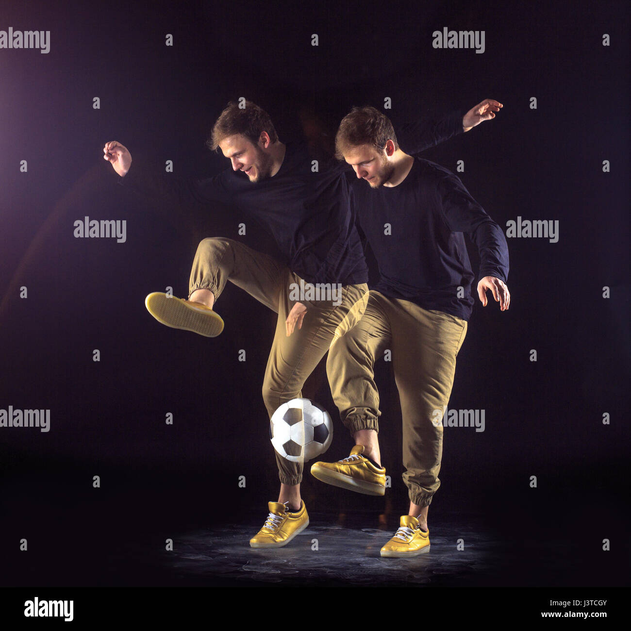 A portrait of a fan with ball on gray studio background. Freestile ...
