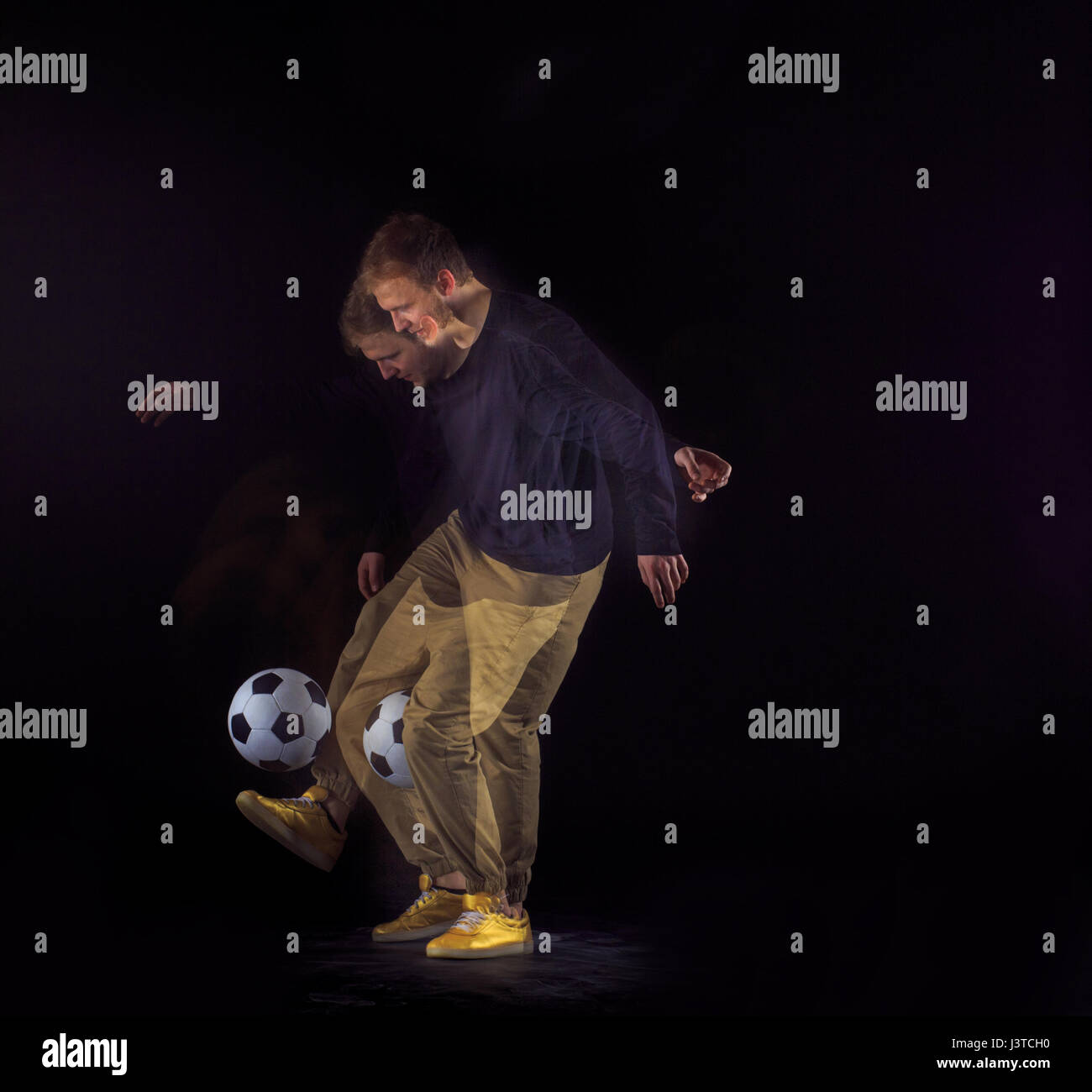 A portrait of a fan with ball on gray studio background. Freestile ...