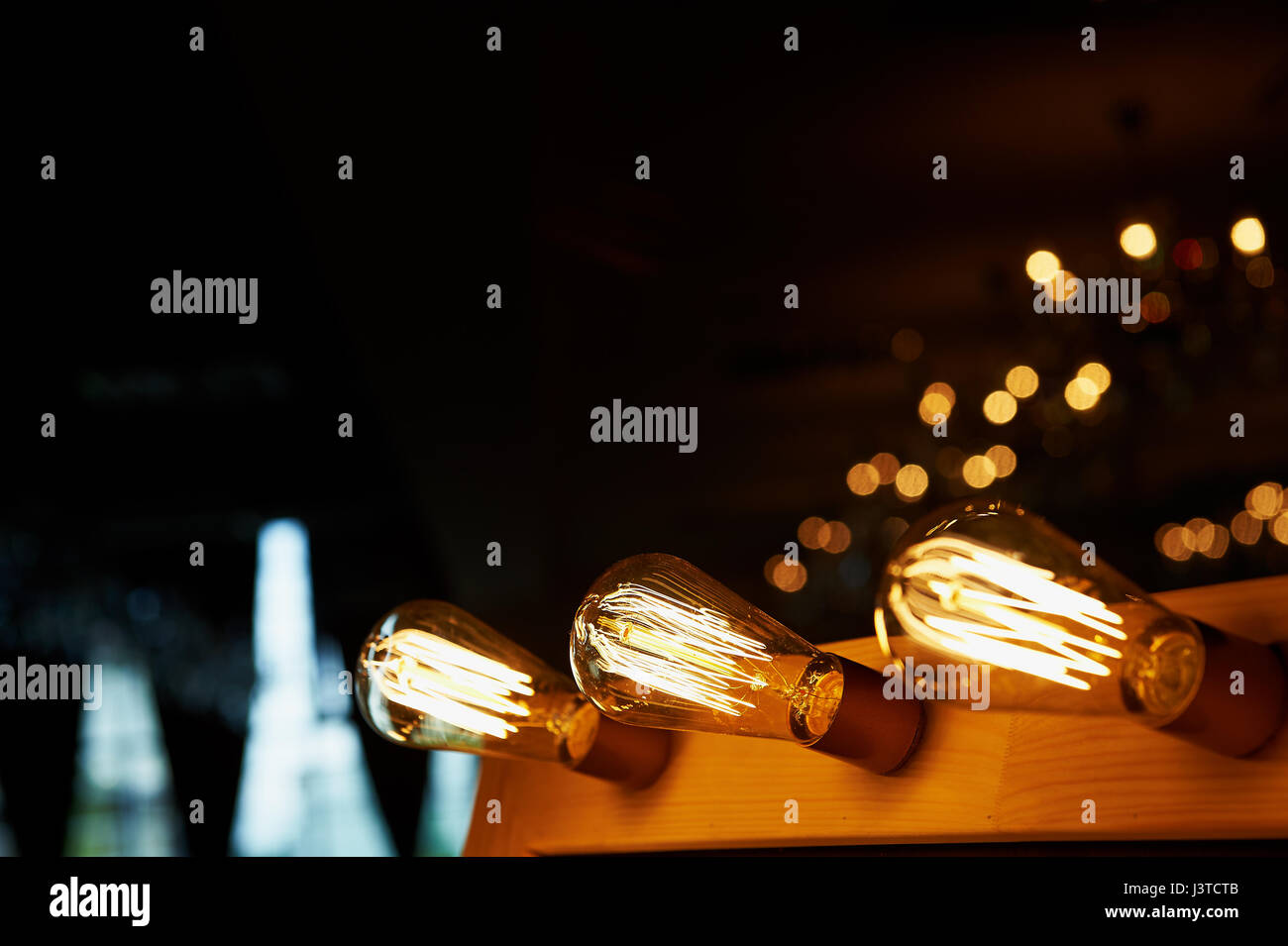 Edison light bulb hanging on a long wire. Cozy warm yellow light.Retro ...