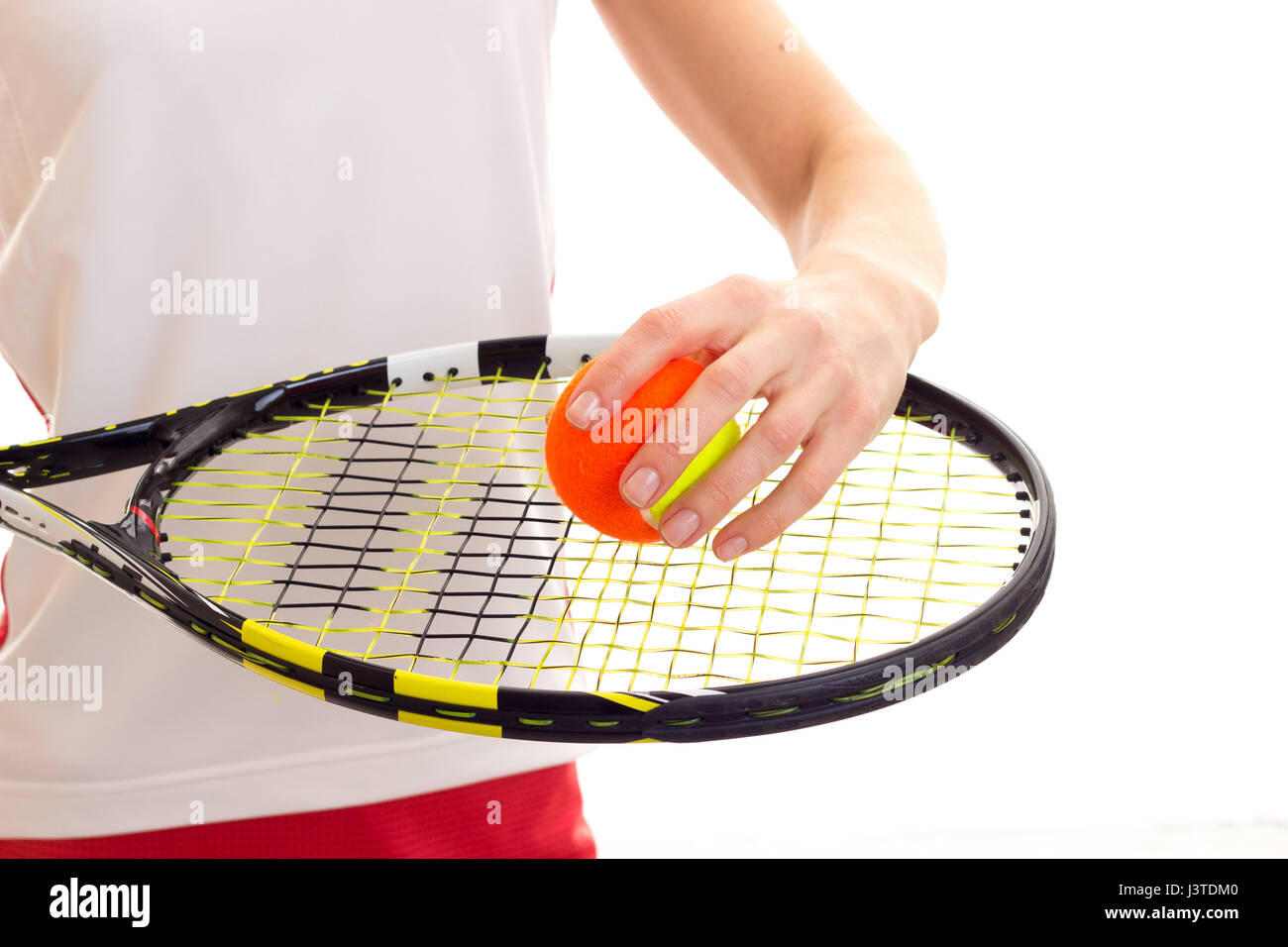 Woman with tennis racquet and ball Stock Photo - Alamy