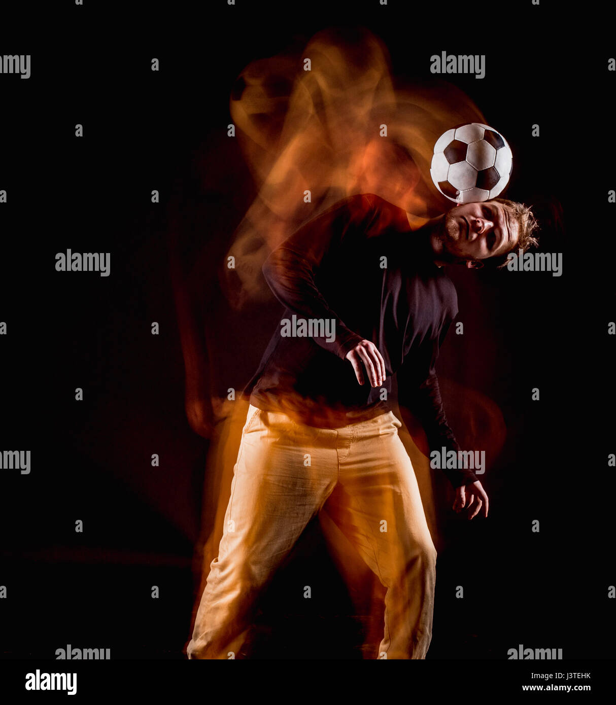 A portrait of a fan with ball on gray studio background. Freestile ...