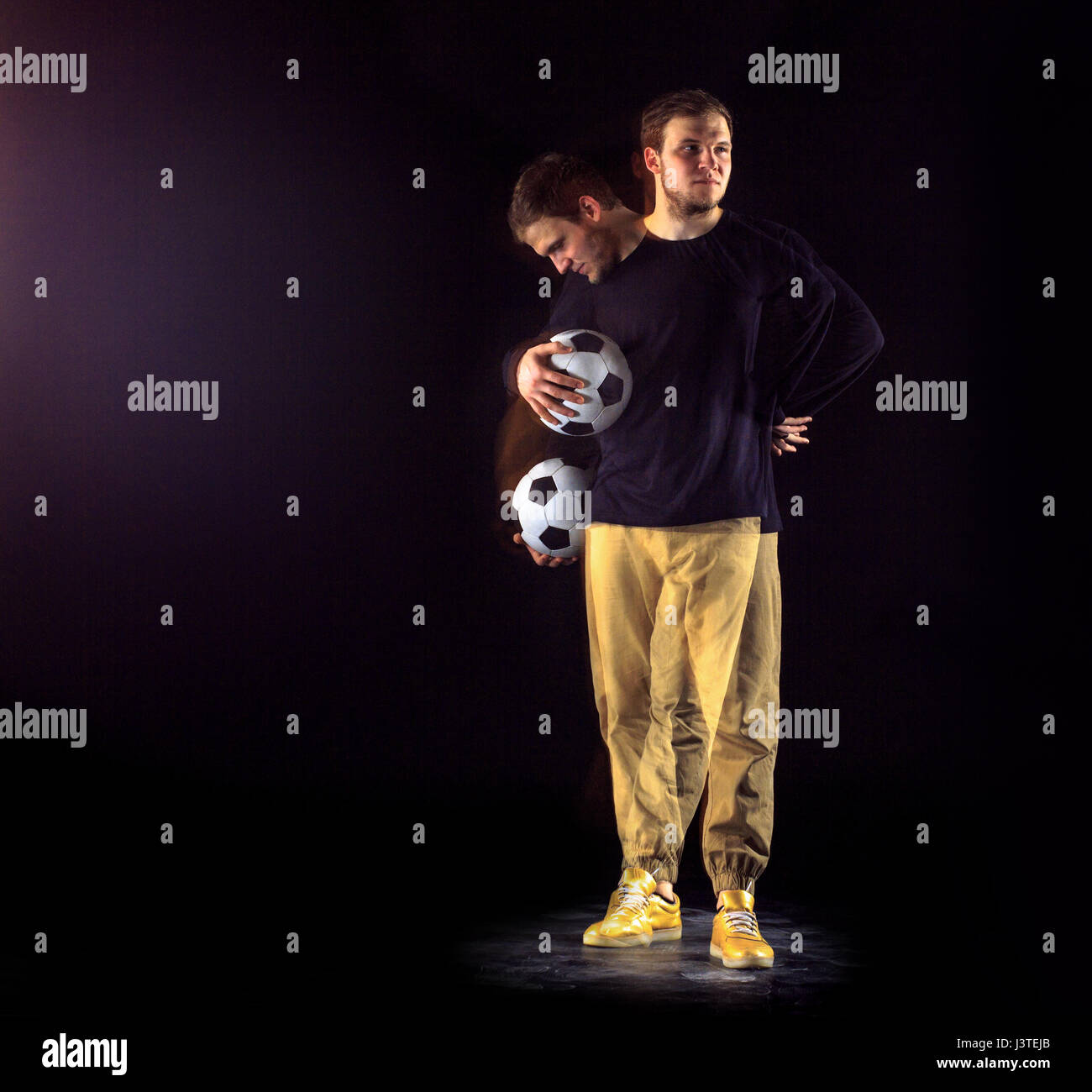 A portrait of a fan with ball on gray studio background. Freestile ...