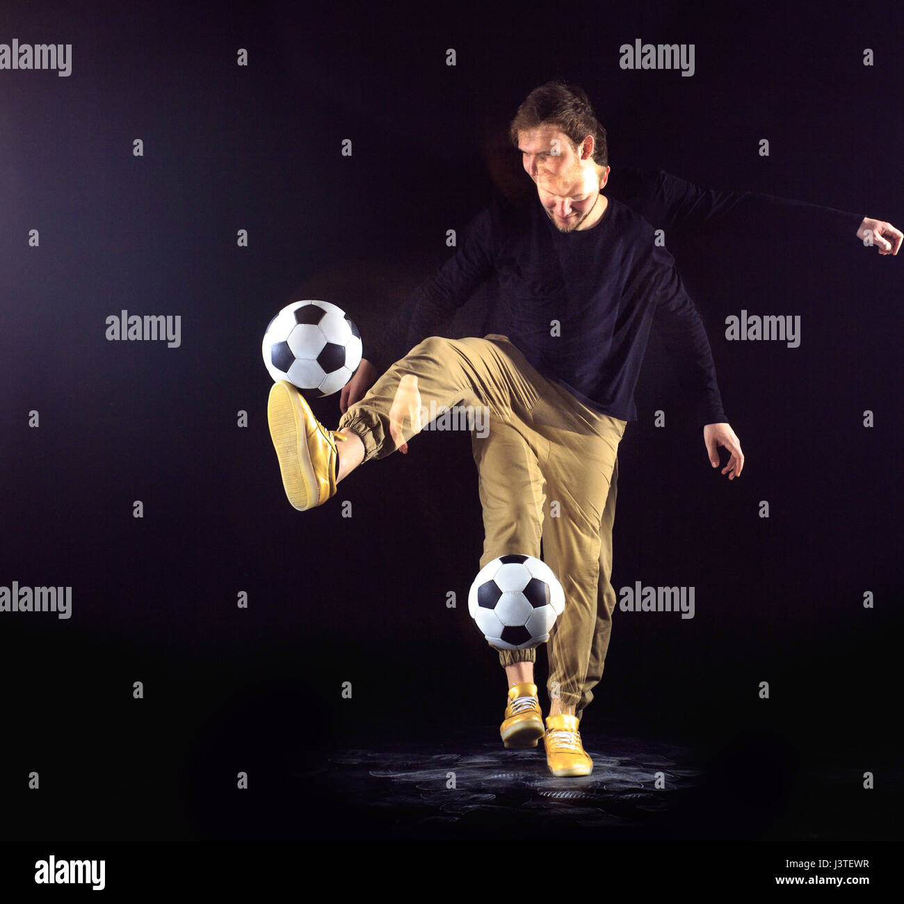 A portrait of a fan with ball on gray studio background. Freestile ...