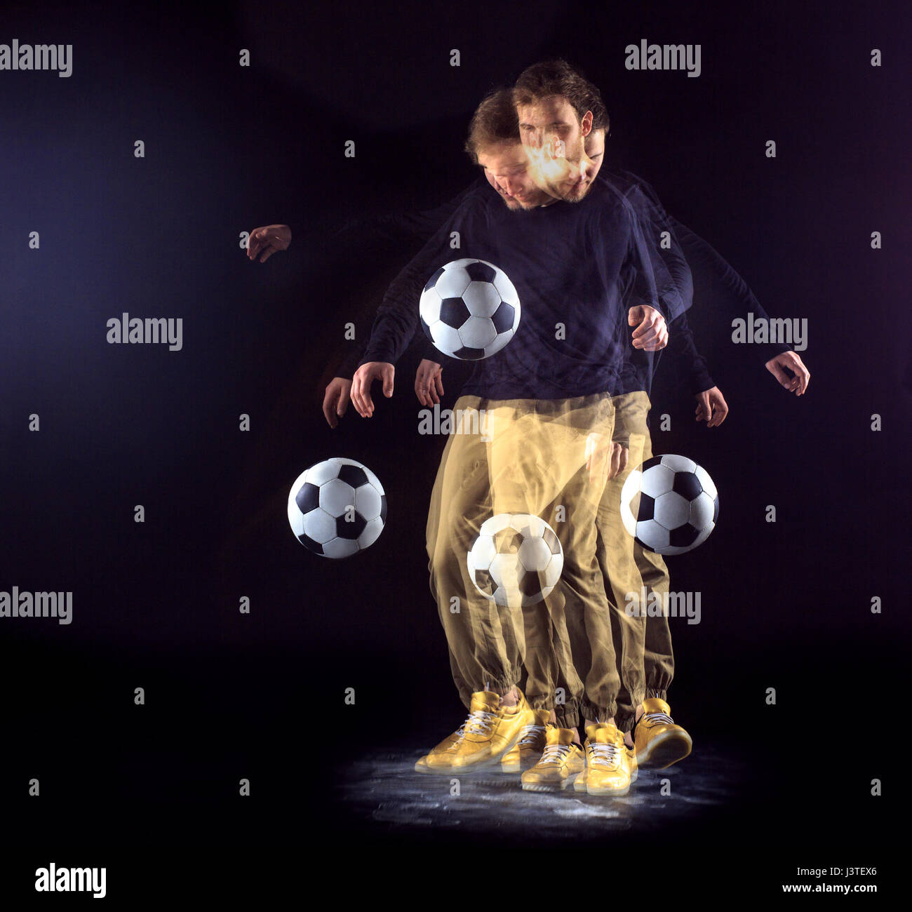 A portrait of a fan with ball on gray studio background. Freestile ...