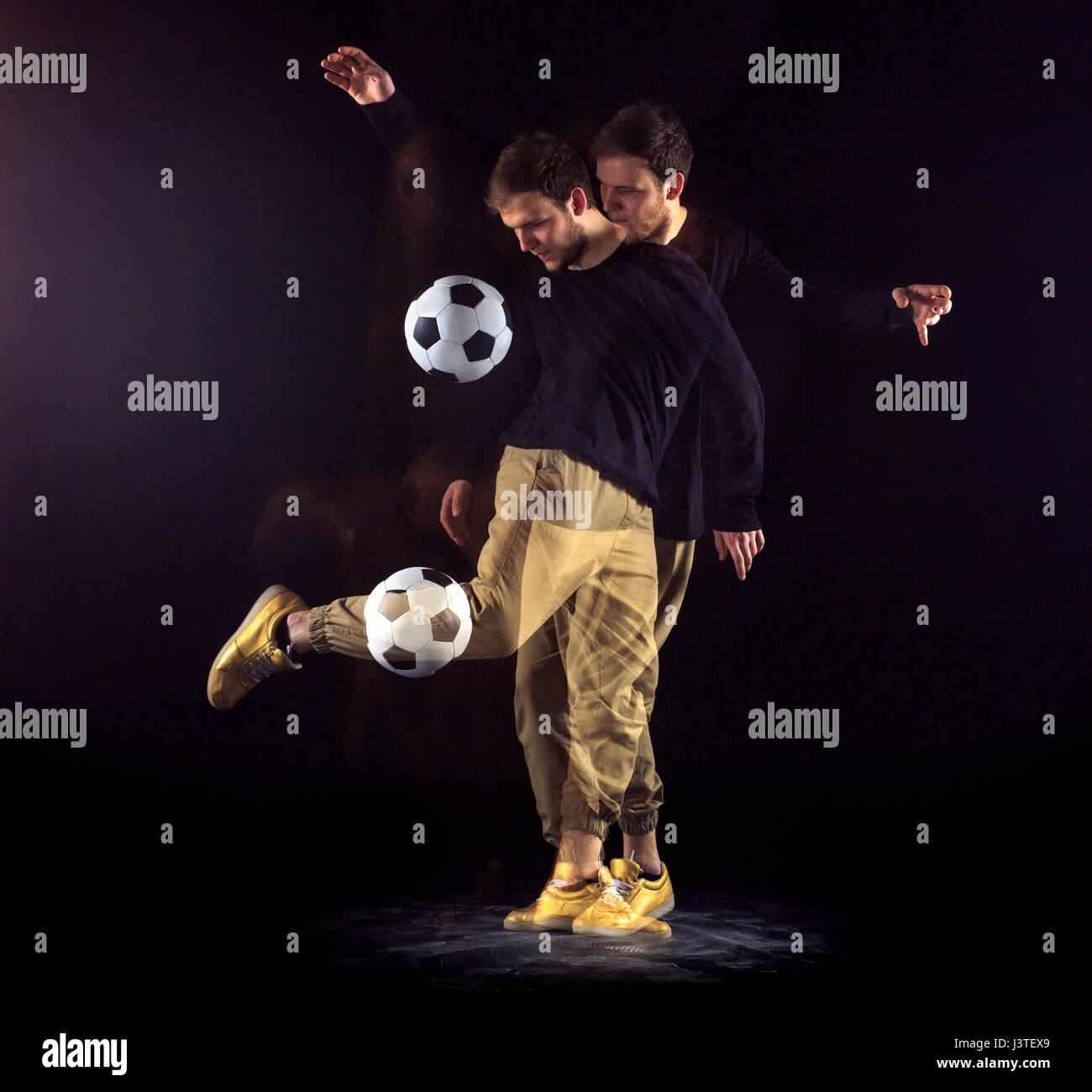 A portrait of a fan with ball on gray studio background. Freestile ...
