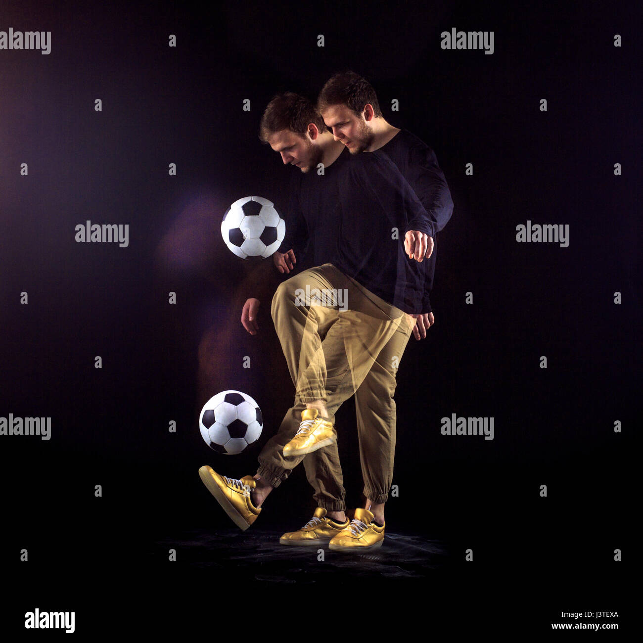 A portrait of a fan with ball on gray studio background. Freestile ...