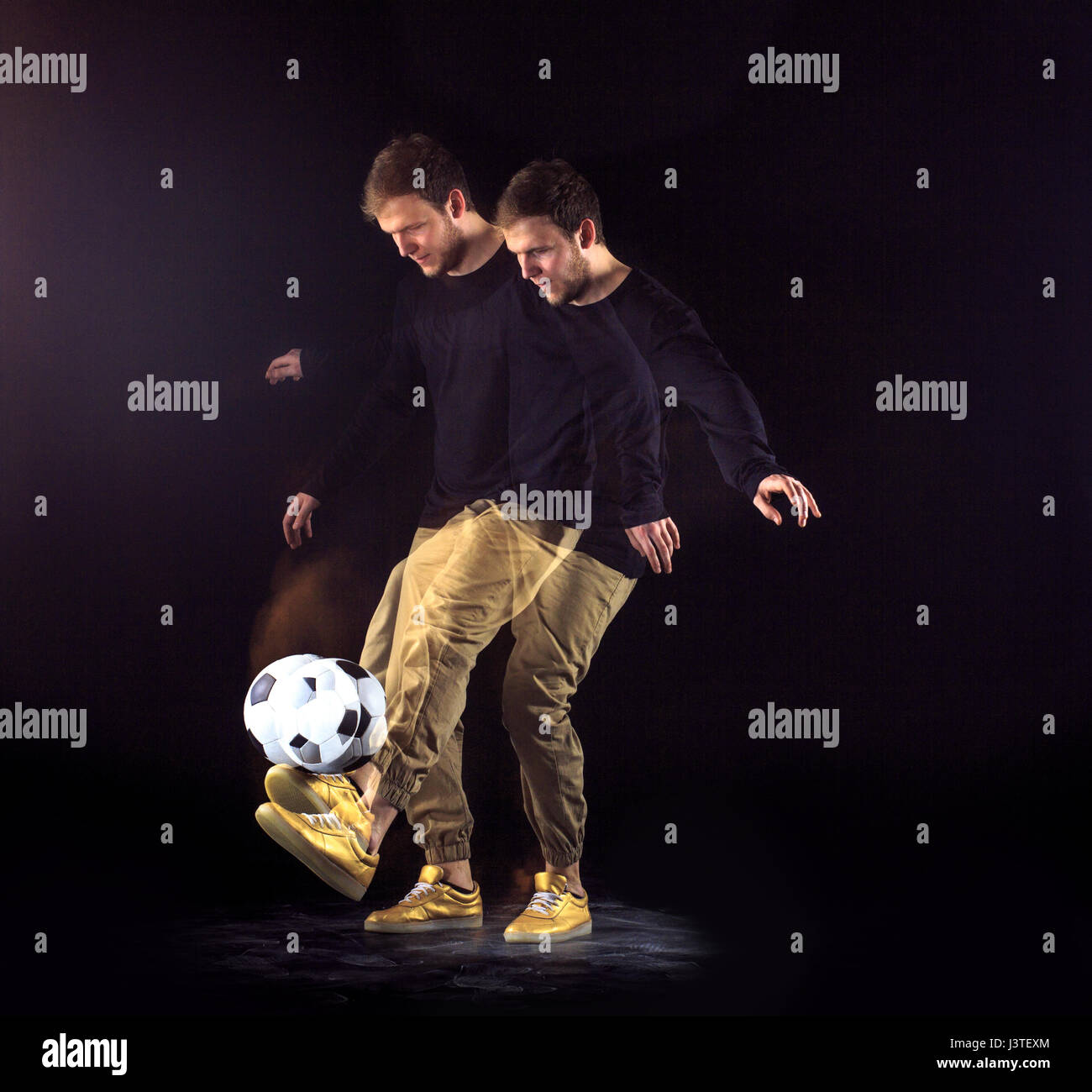 A portrait of a fan with ball on gray studio background. Freestile ...