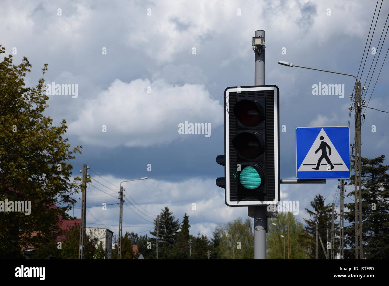 Traffic green light and pedestrian crossing sign Stock Photo - Alamy