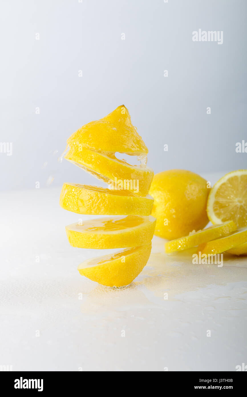 Flying lemon. Sliced lemon on white background. Levity fruit floating ...