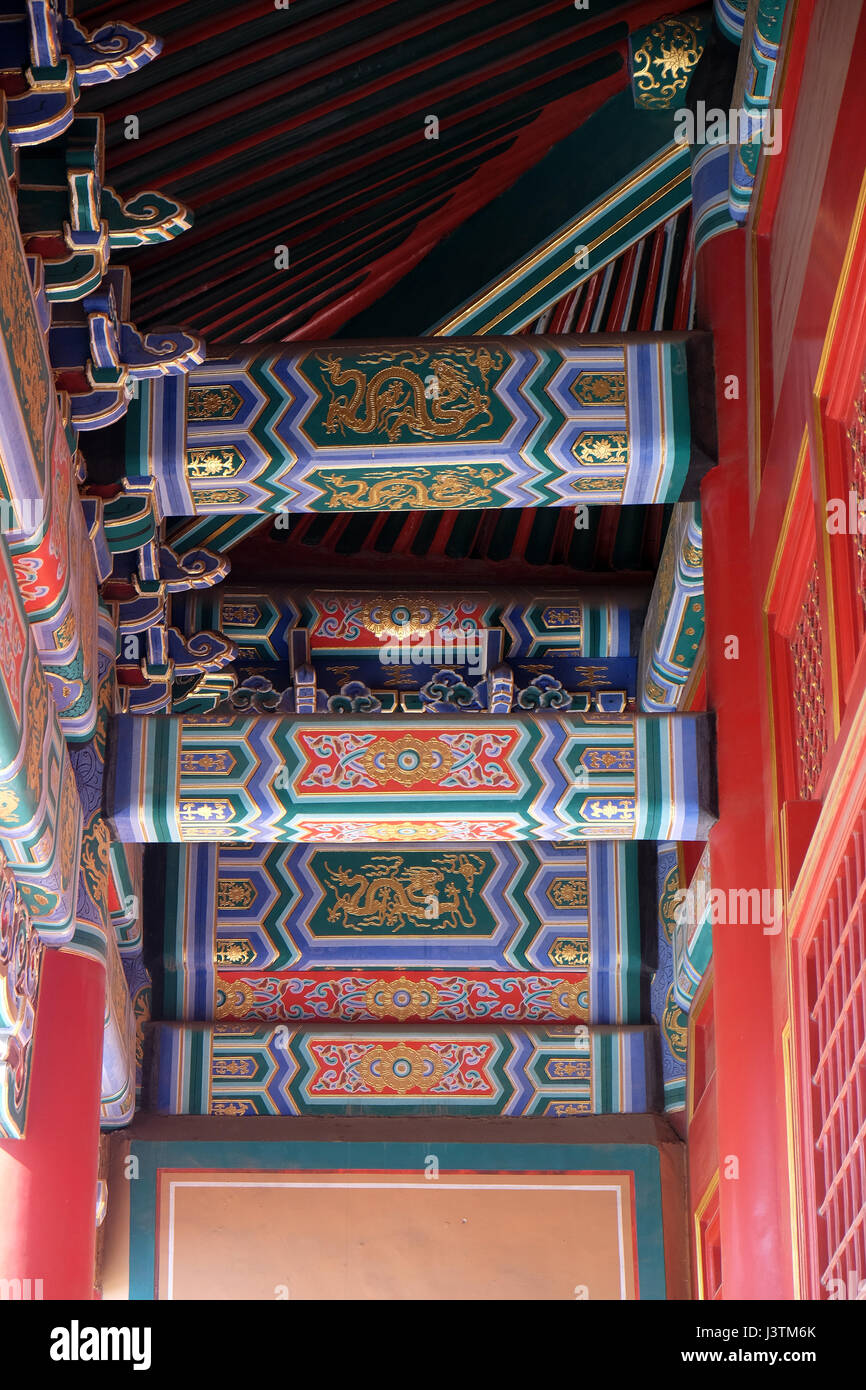 An ornate painted ceiling on a building in the Forbidden City in ...