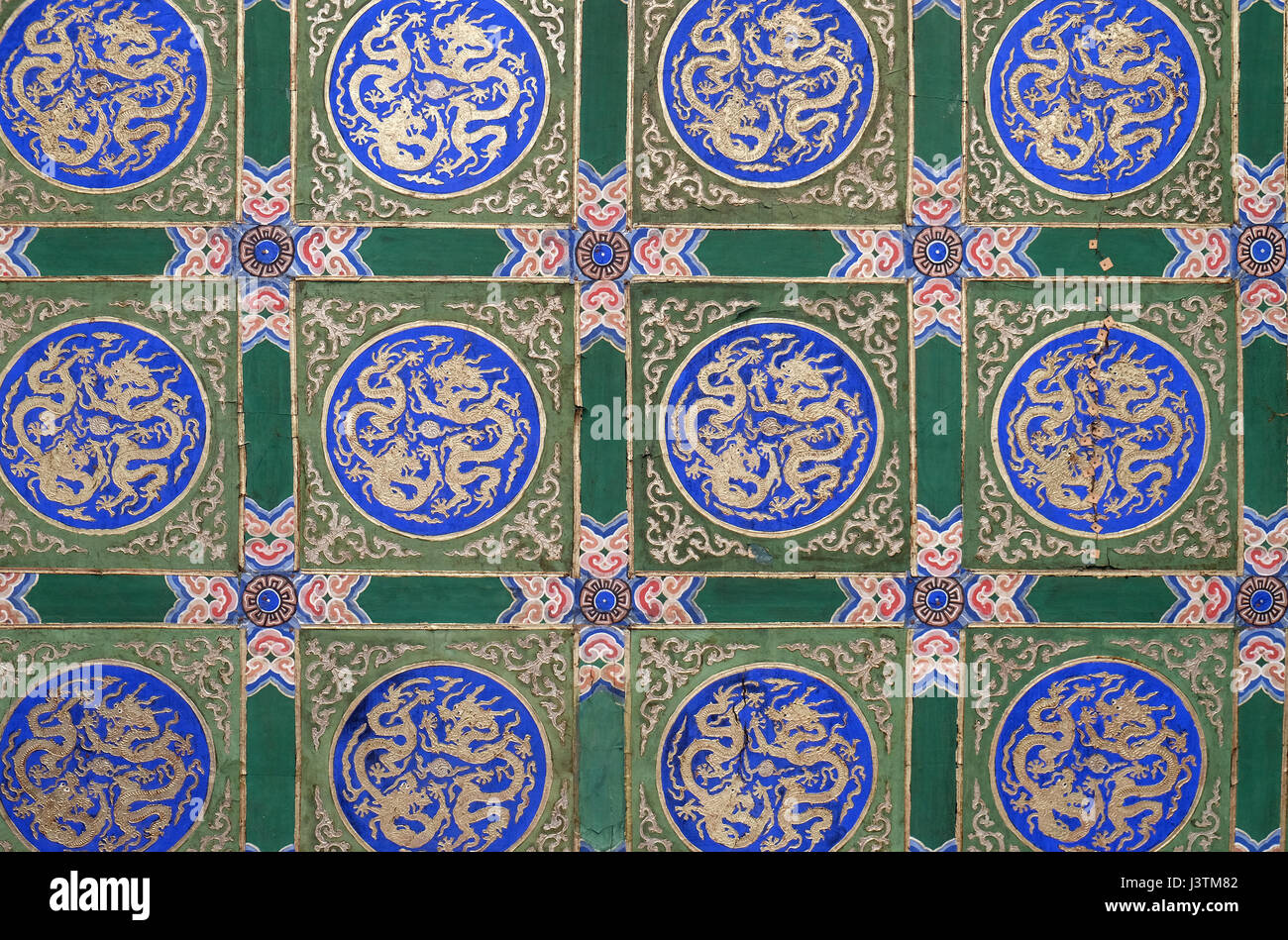 An ornate painted ceiling on a building in the Forbidden City in ...