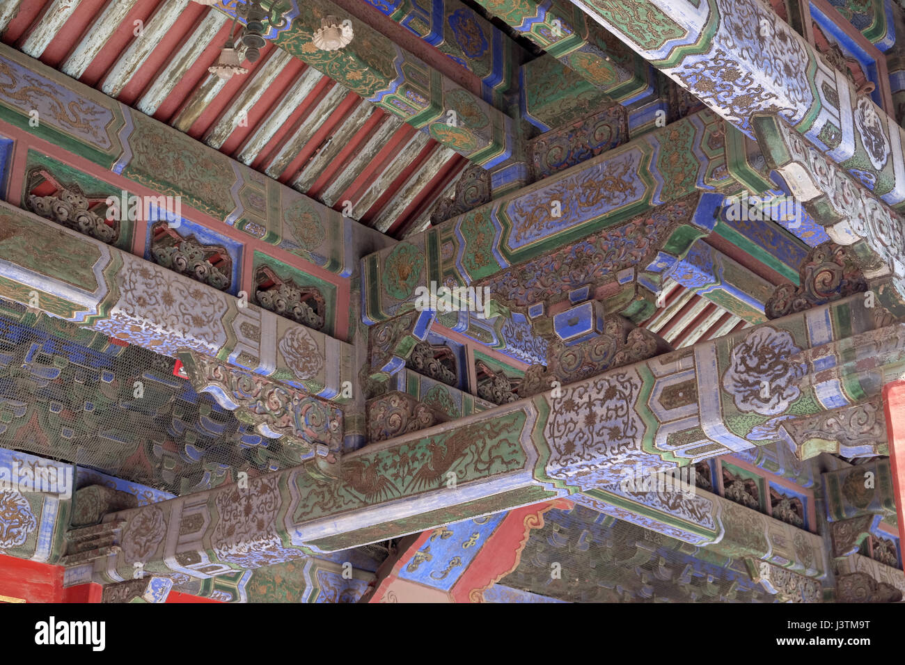 An ornate painted ceiling on a building in the Forbidden City in ...
