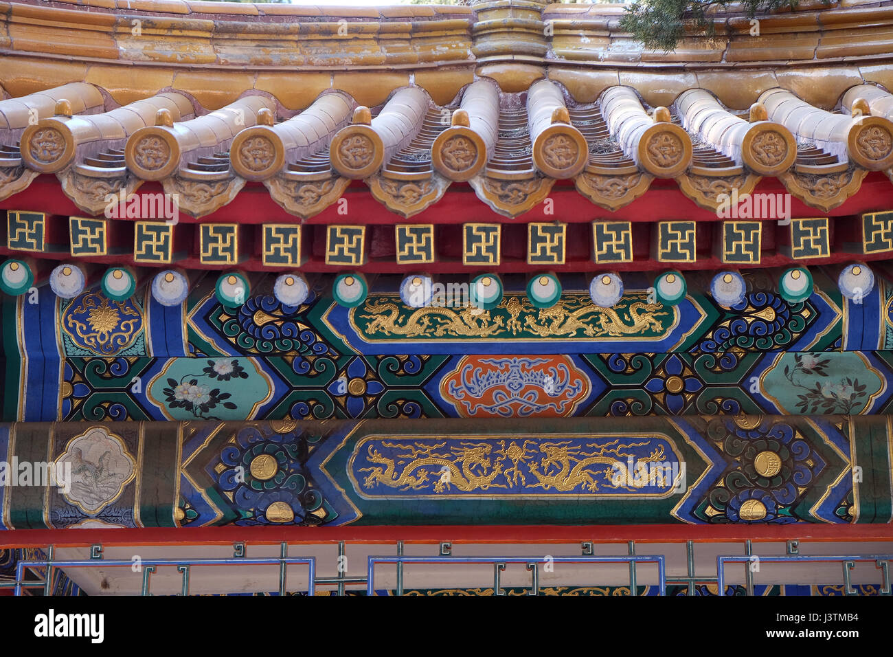 An ornate painted ceiling on a building in the Forbidden City in ...