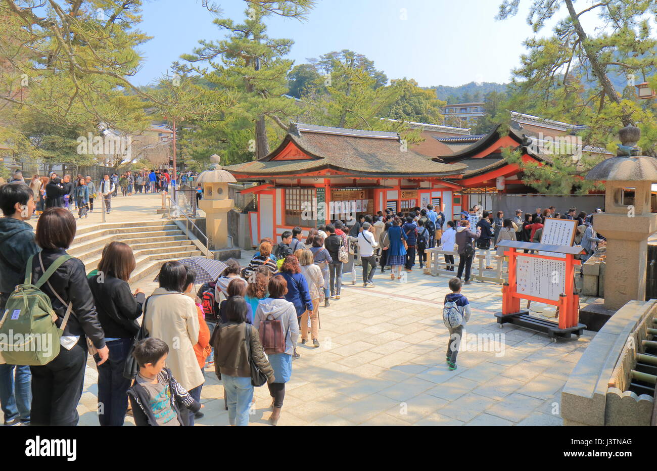 People queue to buy admission for Itsukushima shrine in Miyajima in ...