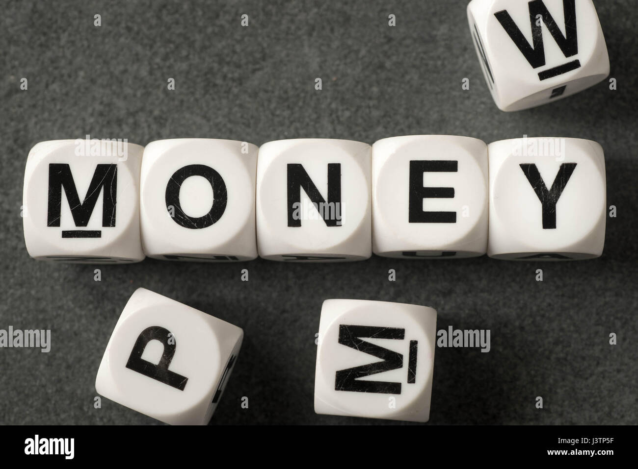 word money on white toy cubes Stock Photo - Alamy