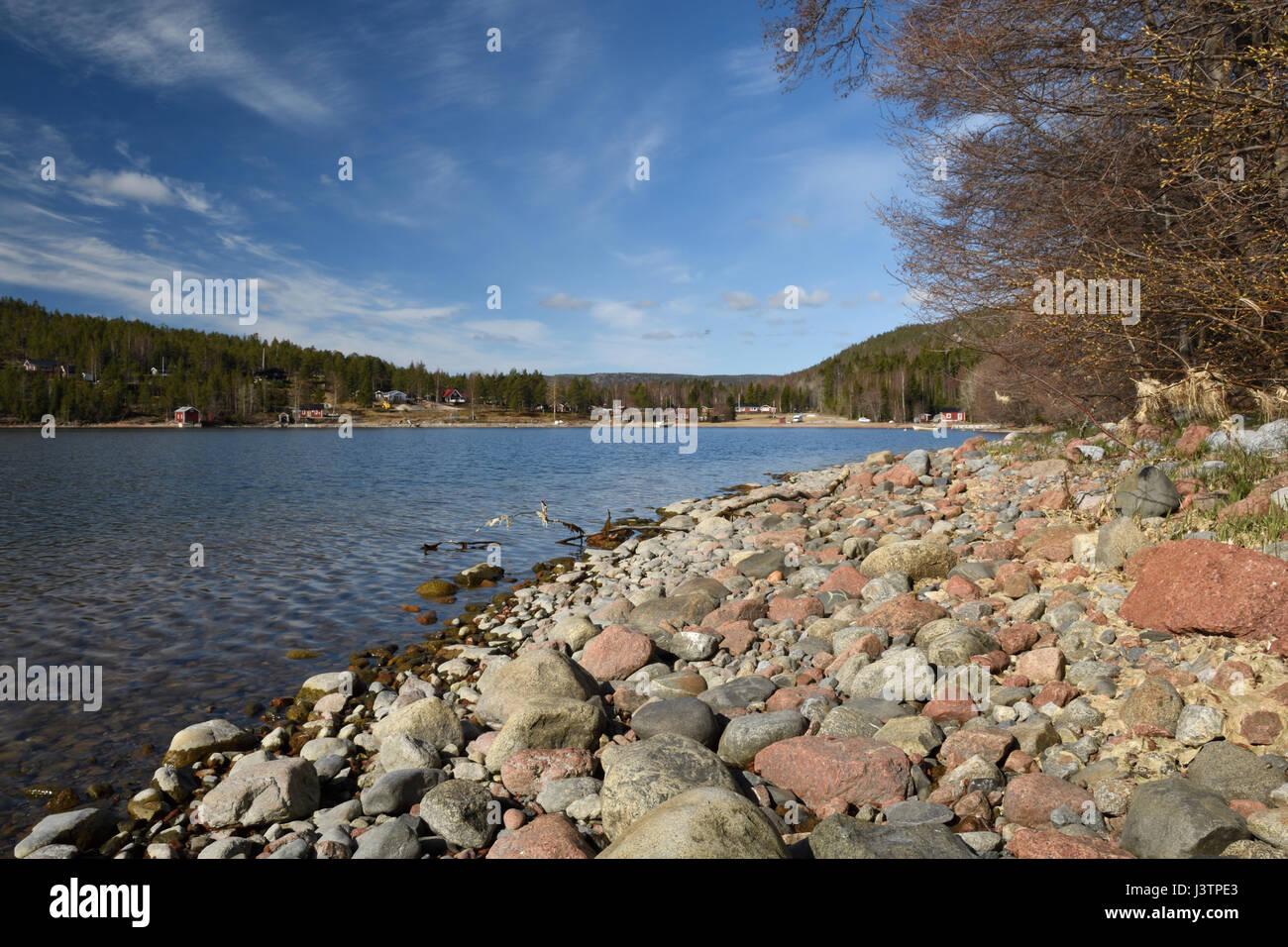 Bay with soft rounded granite stones at the sea shore, picture from the ...