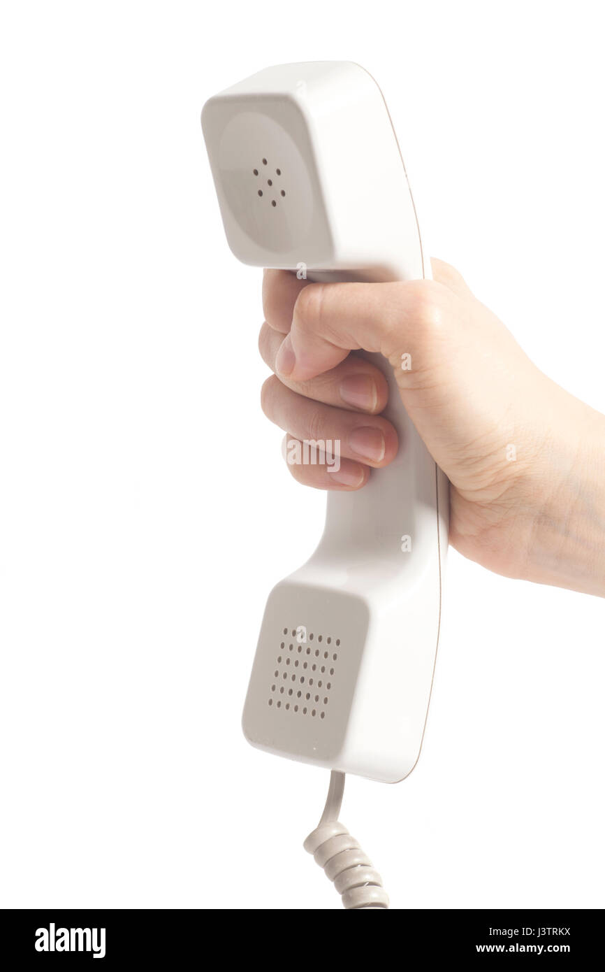 Hand holding white telephone tube isolated on white Stock Photo - Alamy