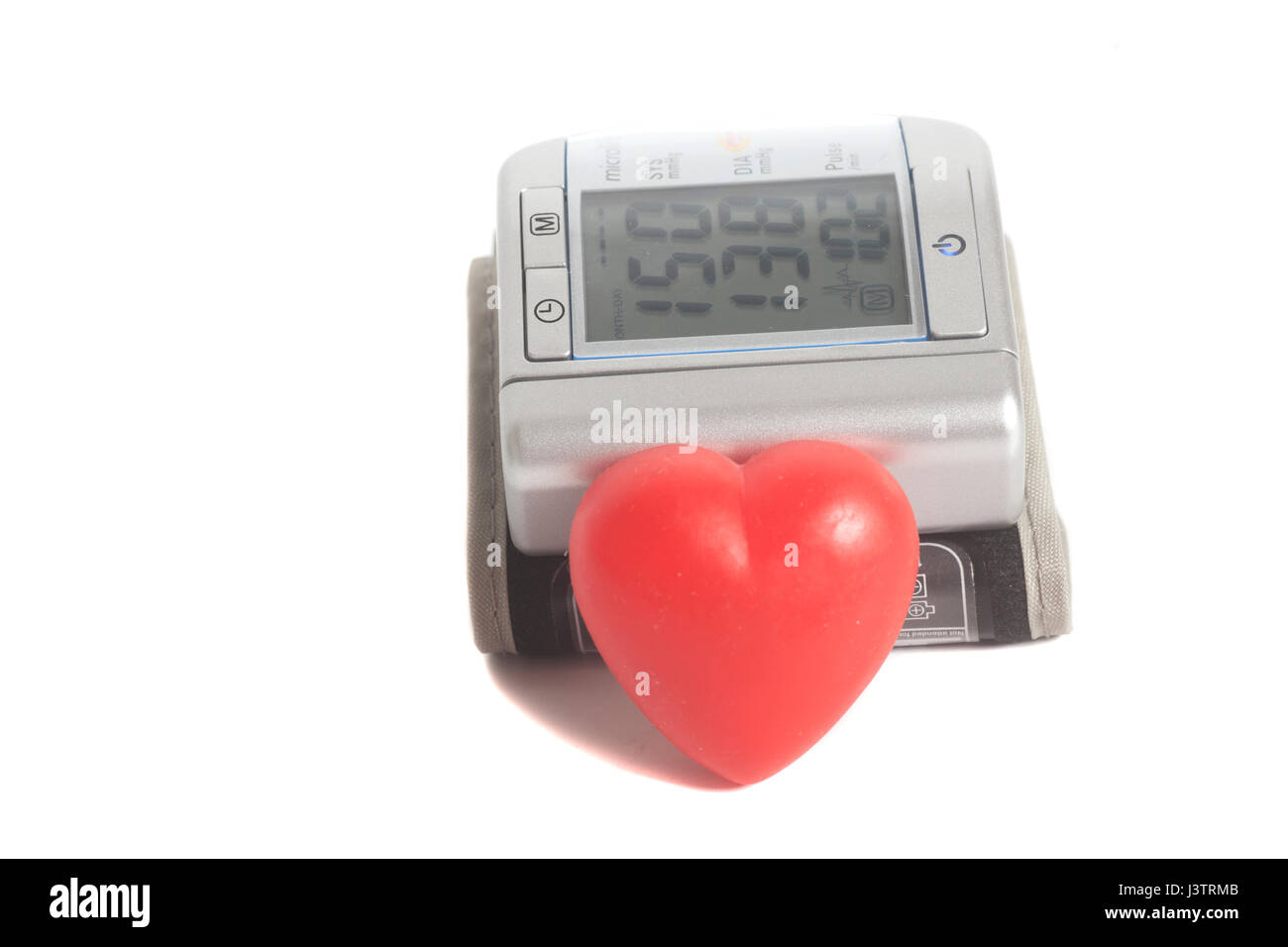 Digital blood pressure meter with heart symbol isolated on white ...