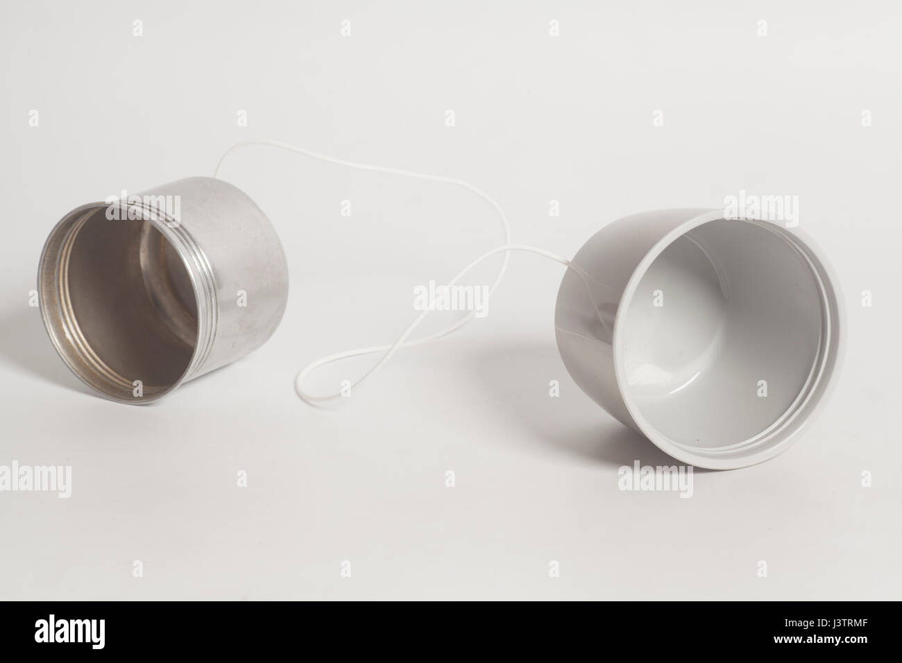Tin Can Telephone on white Stock Photo - Alamy