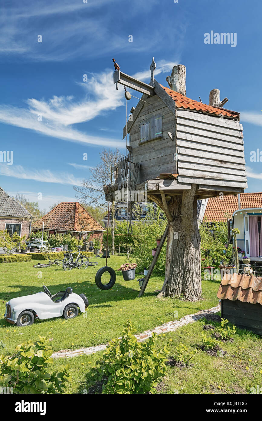 Treehouse in a garden in the village De Woude in The Netherlands Stock ...