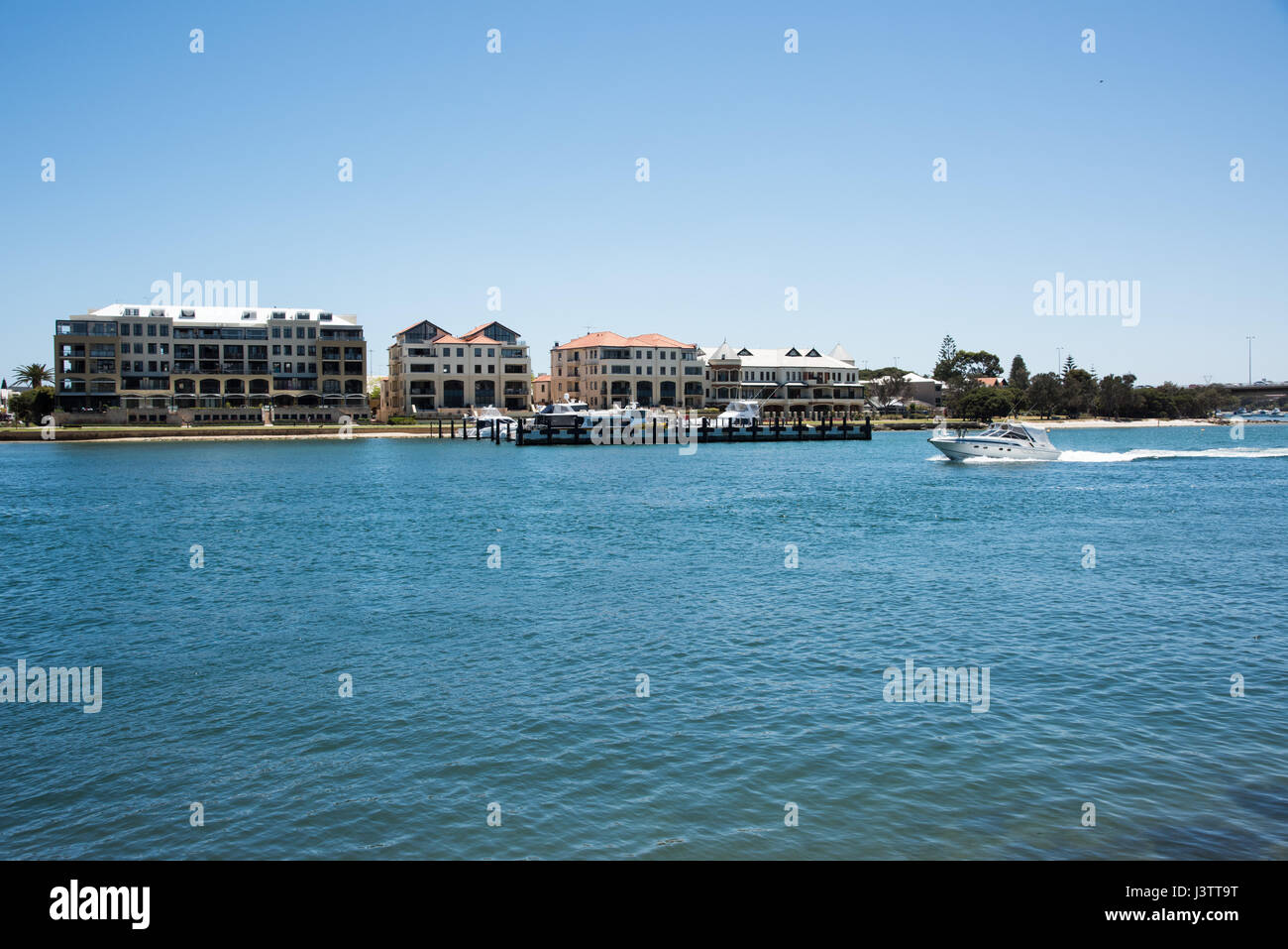 Waterfront housing with boat marina on the Swan River with yacht in ...
