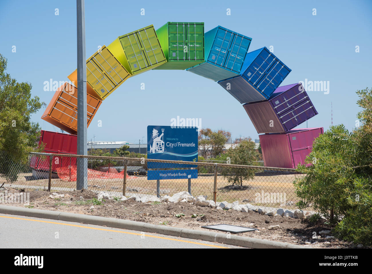 Rainbow shipping container sculpture by Marcus Canning on beach reserve ...