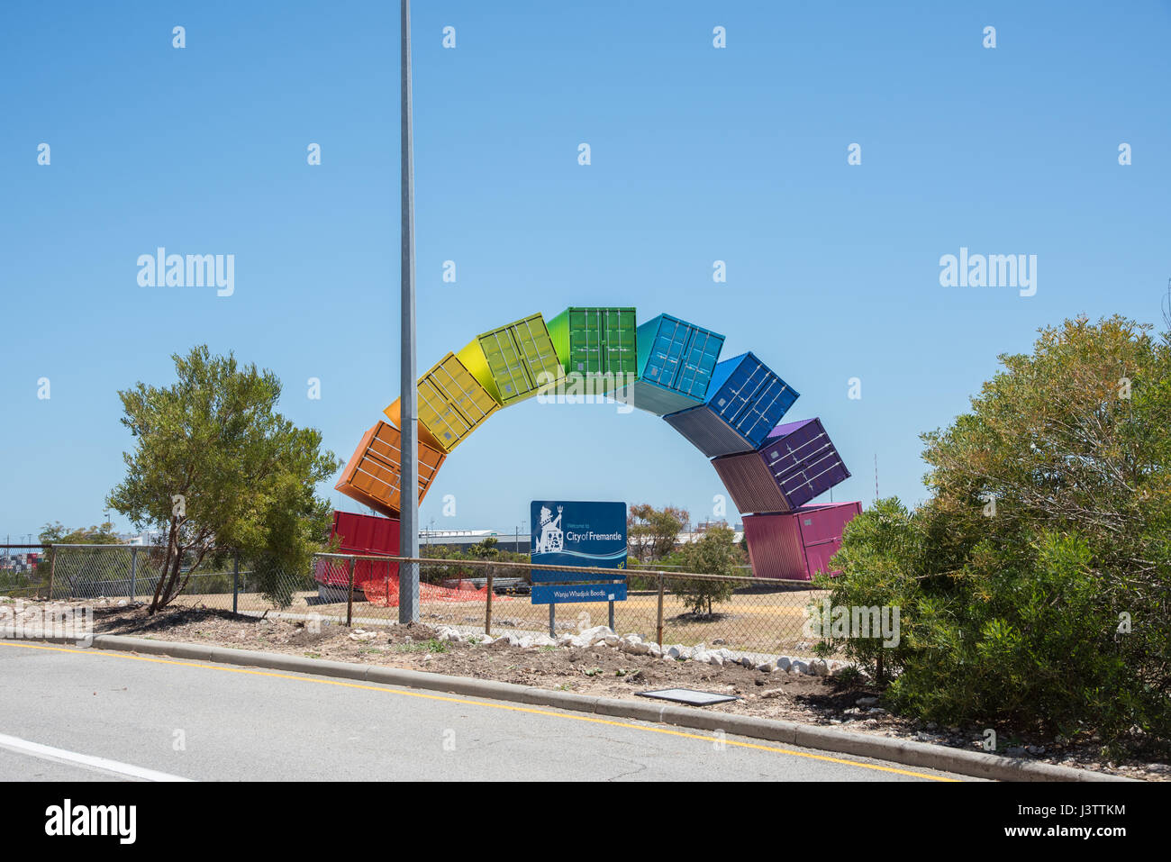Rainbow shipping container sculpture by Marcus Canning on beach reserve ...