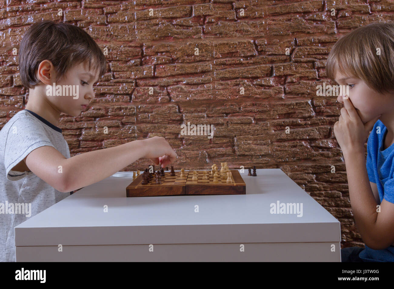 Kids playing a game of chess. Game, education, lifestyle concept Stock ...
