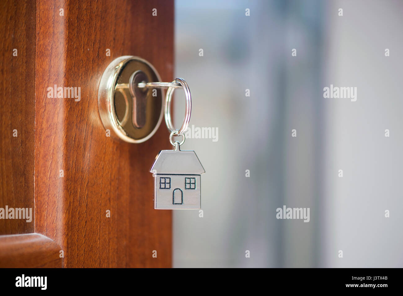 House key in the door Stock Photo - Alamy